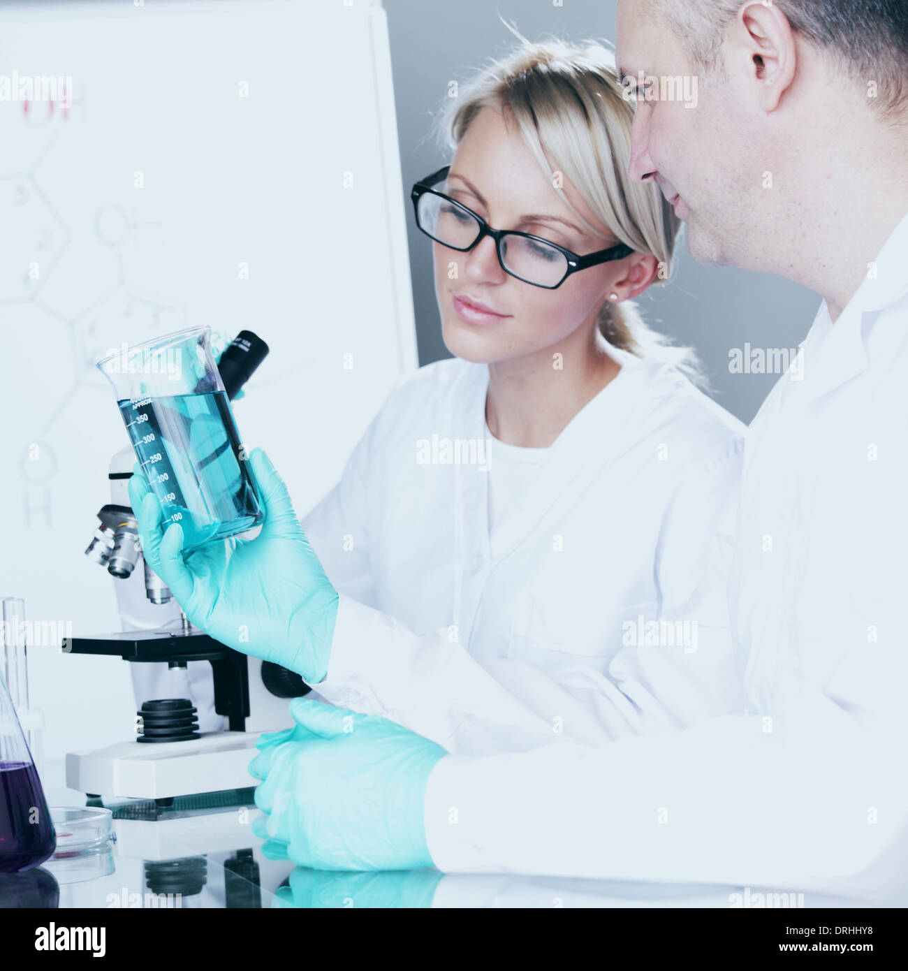two scientist in chemical lab conducting experiments Stock Photo - Alamy
