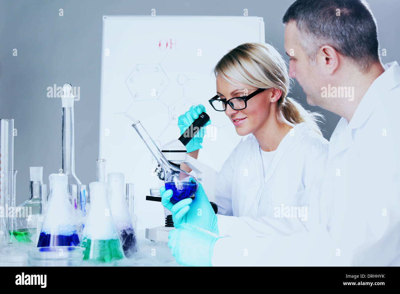 two scientist in chemical lab conducting experiments Stock Photo - Alamy