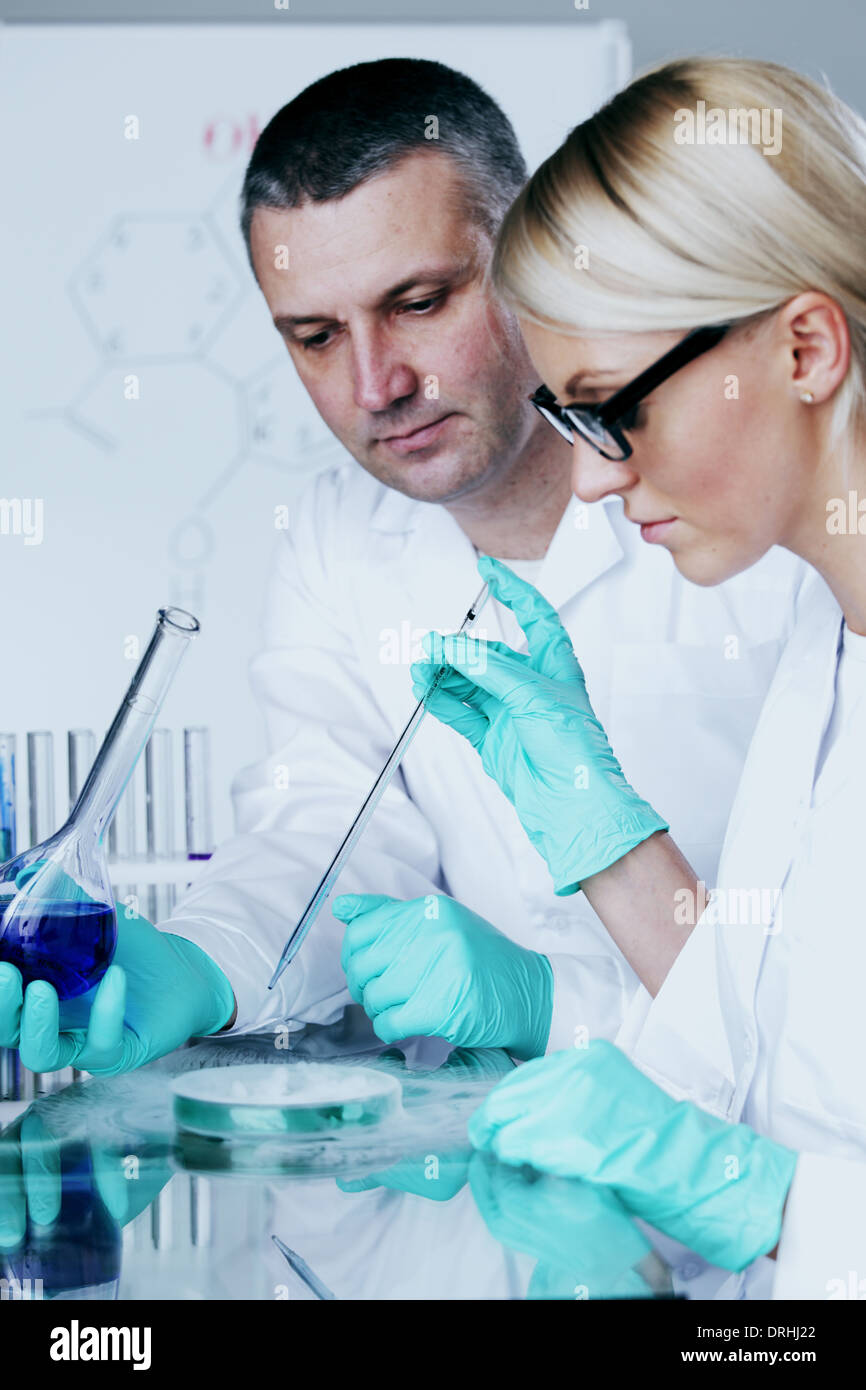 two scientist in chemical lab conducting experiments Stock Photo - Alamy
