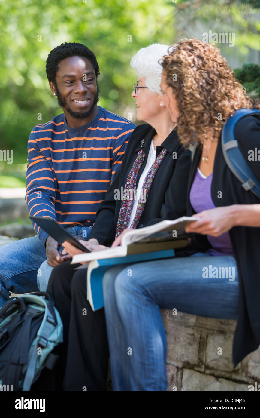 College Professor Helping Students Stock Photo - Alamy