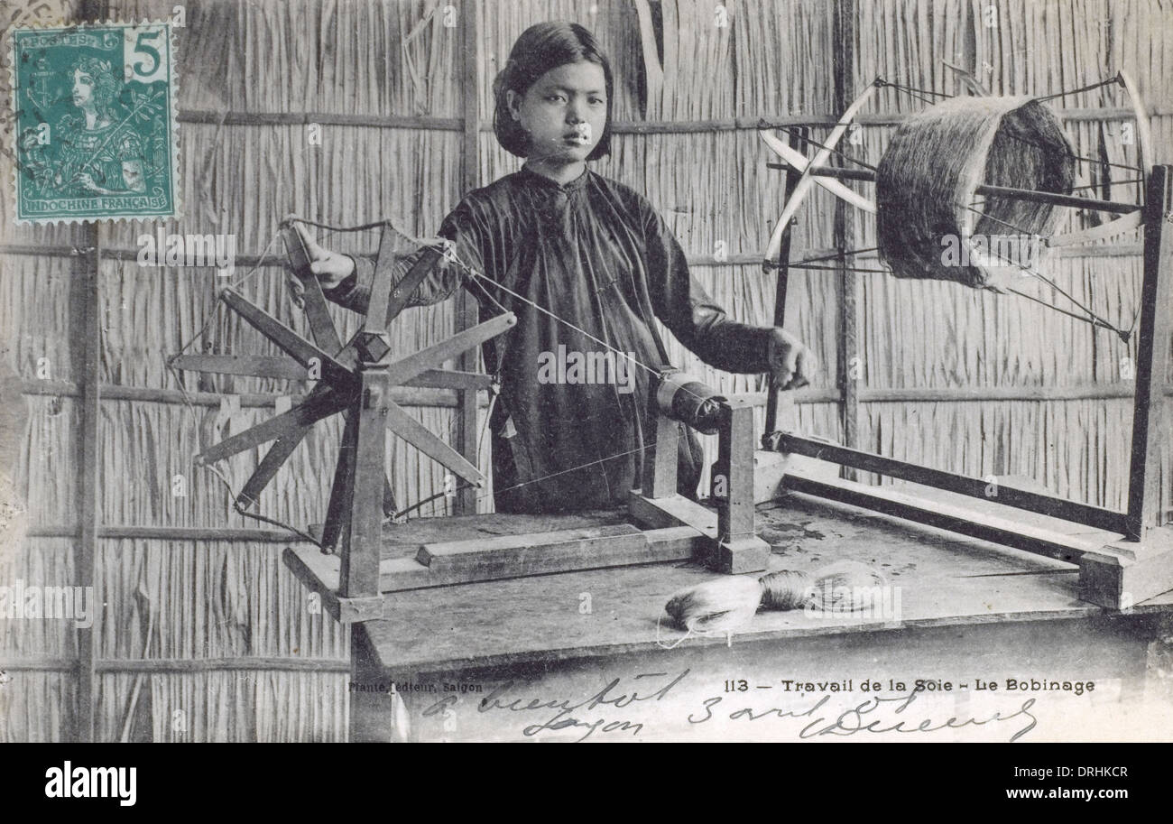 Vietnamese girl spinning silk by hand Stock Photo - Alamy