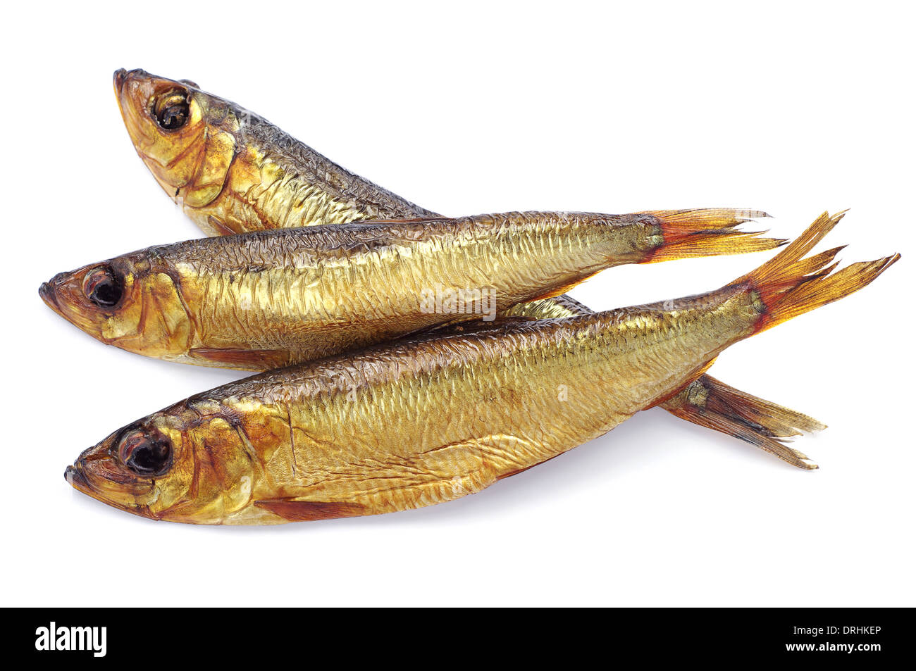 Three smoked fish on white background Stock Photo - Alamy