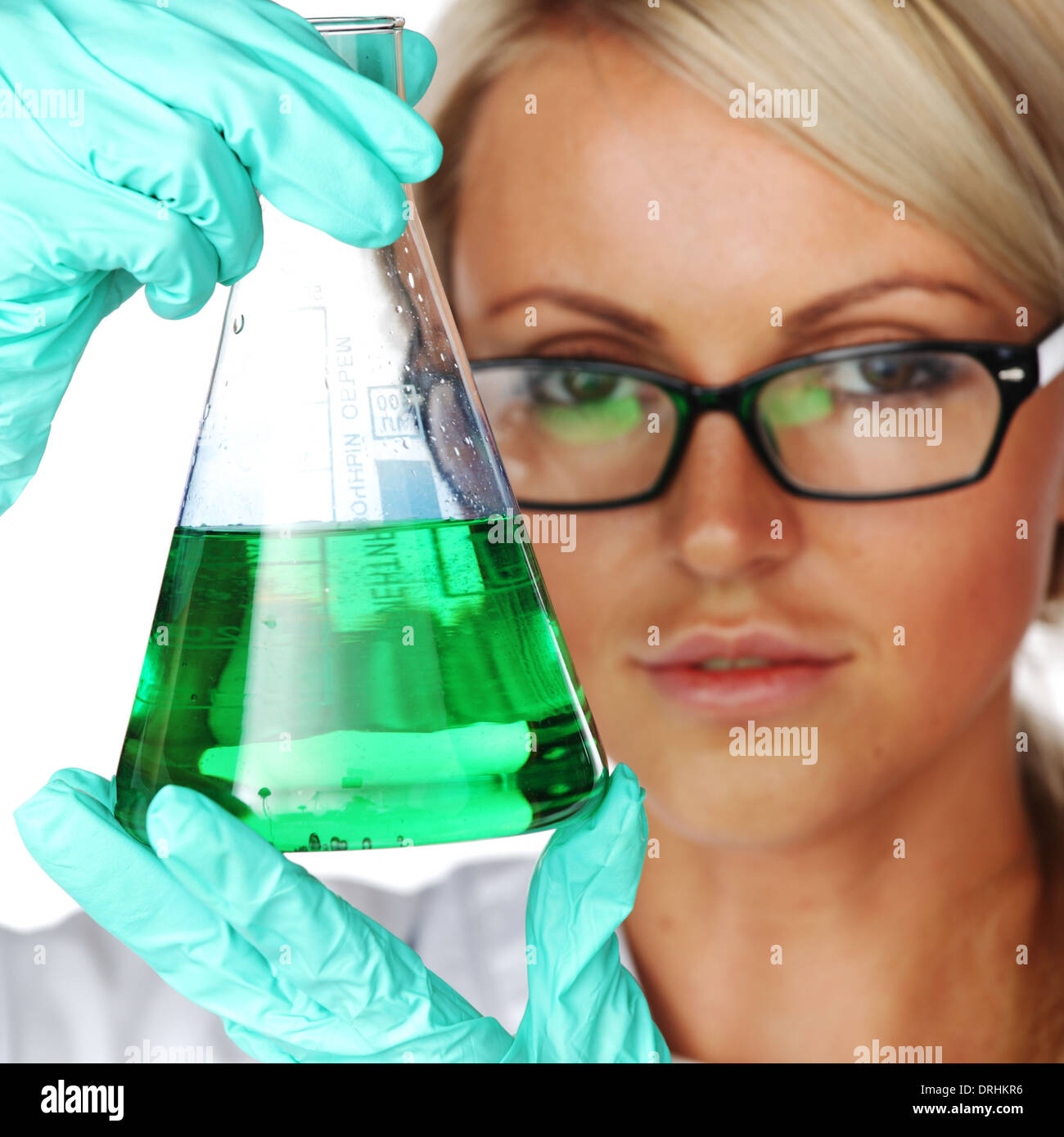 Woman conducting a chemical experiment Stock Photo - Alamy
