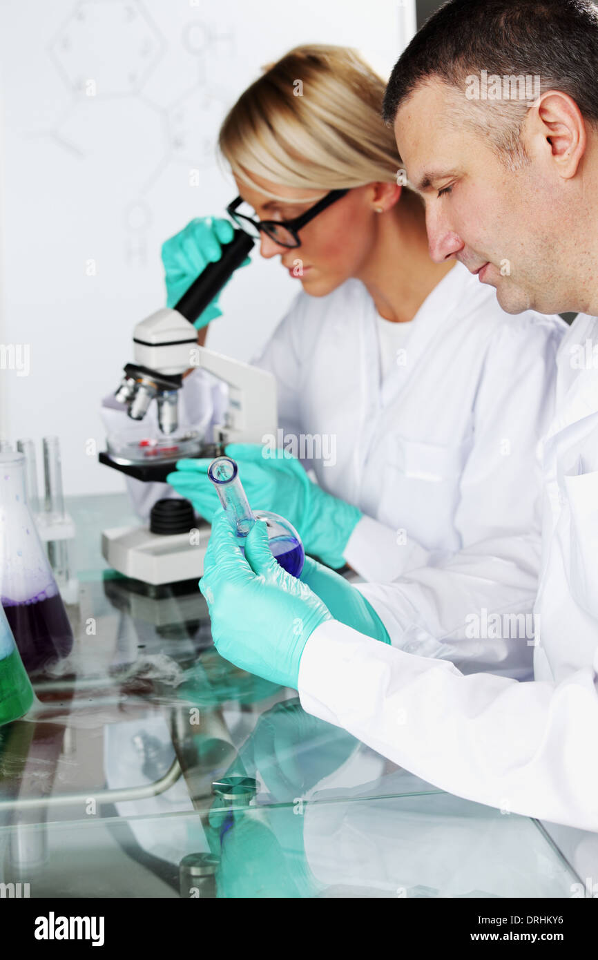 two scientist in chemical lab conducting experiments Stock Photo - Alamy