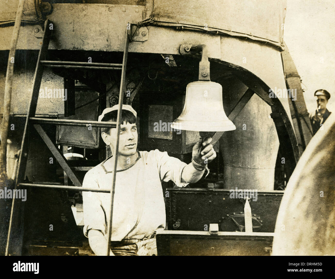 Sailor ringing new bell of HMS Broke, WW1 Stock Photo - Alamy