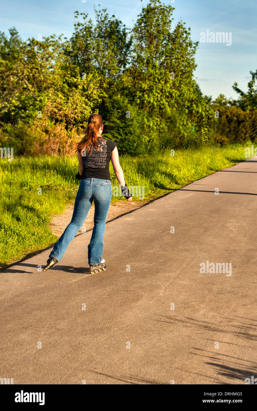 Woman roller blading hi-res stock photography and images - Alamy