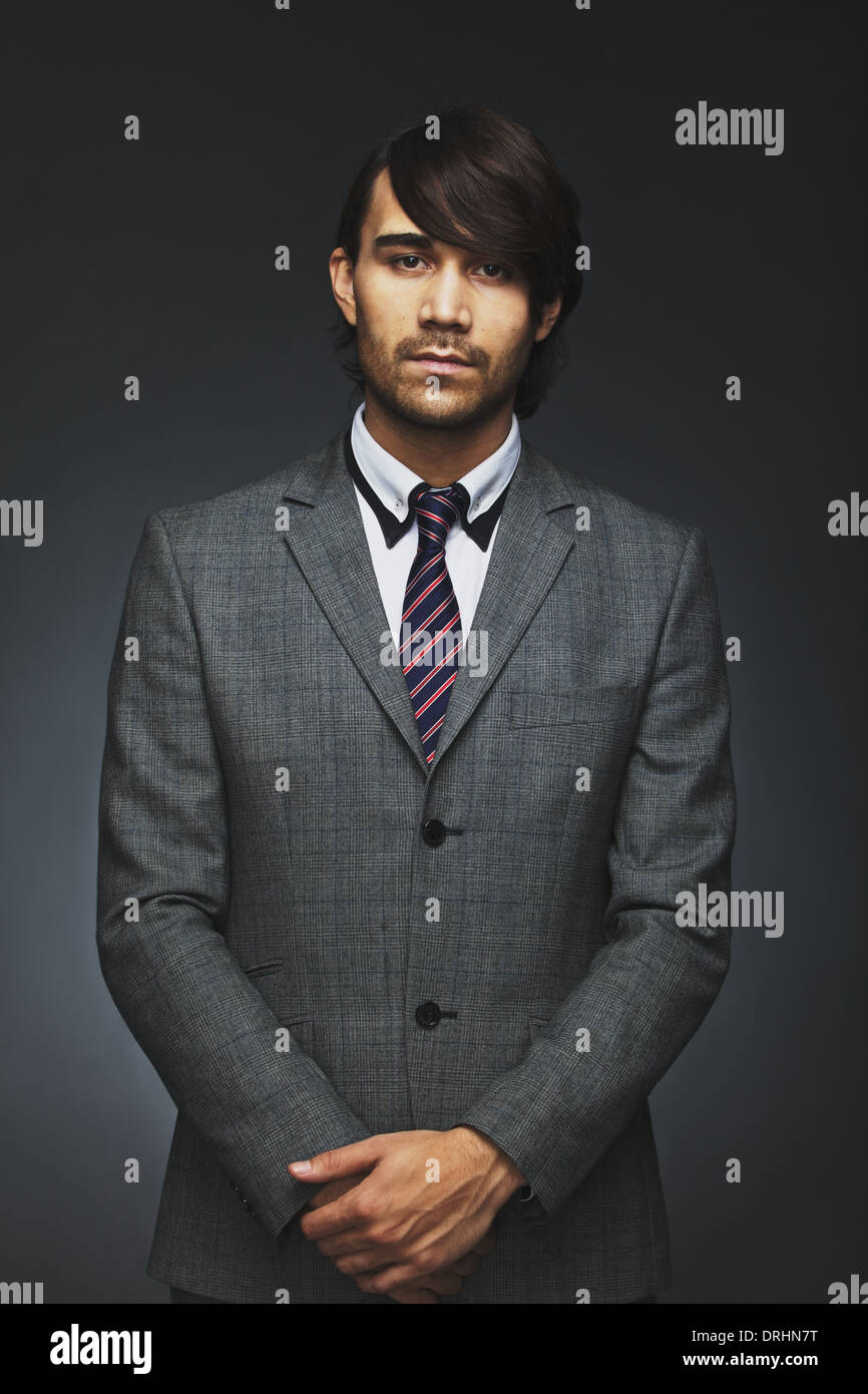 Portrait of handsome young businessman looking at camera. Asian male ...