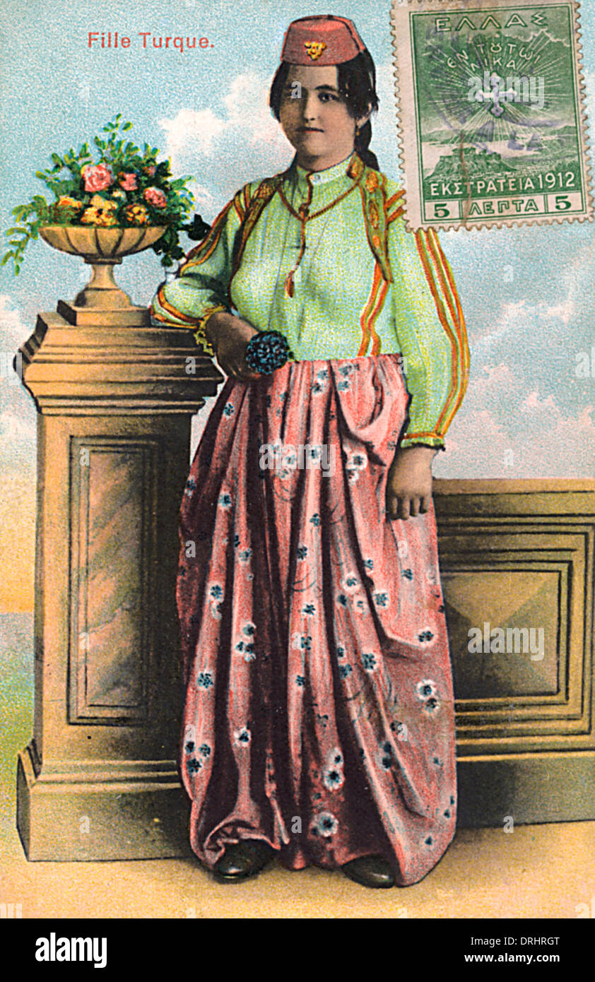 Turkish Woman in floral skirt and red fez hat Stock Photo - Alamy
