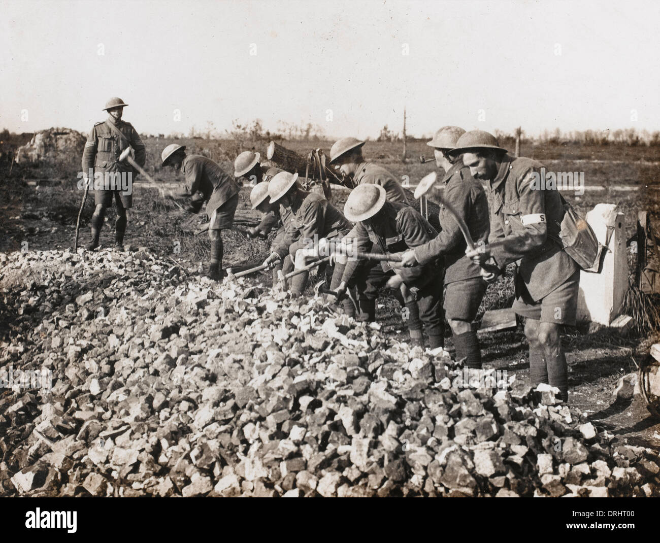 Brtish troops breaking stones, Flanders, WW1 Stock Photo - Alamy