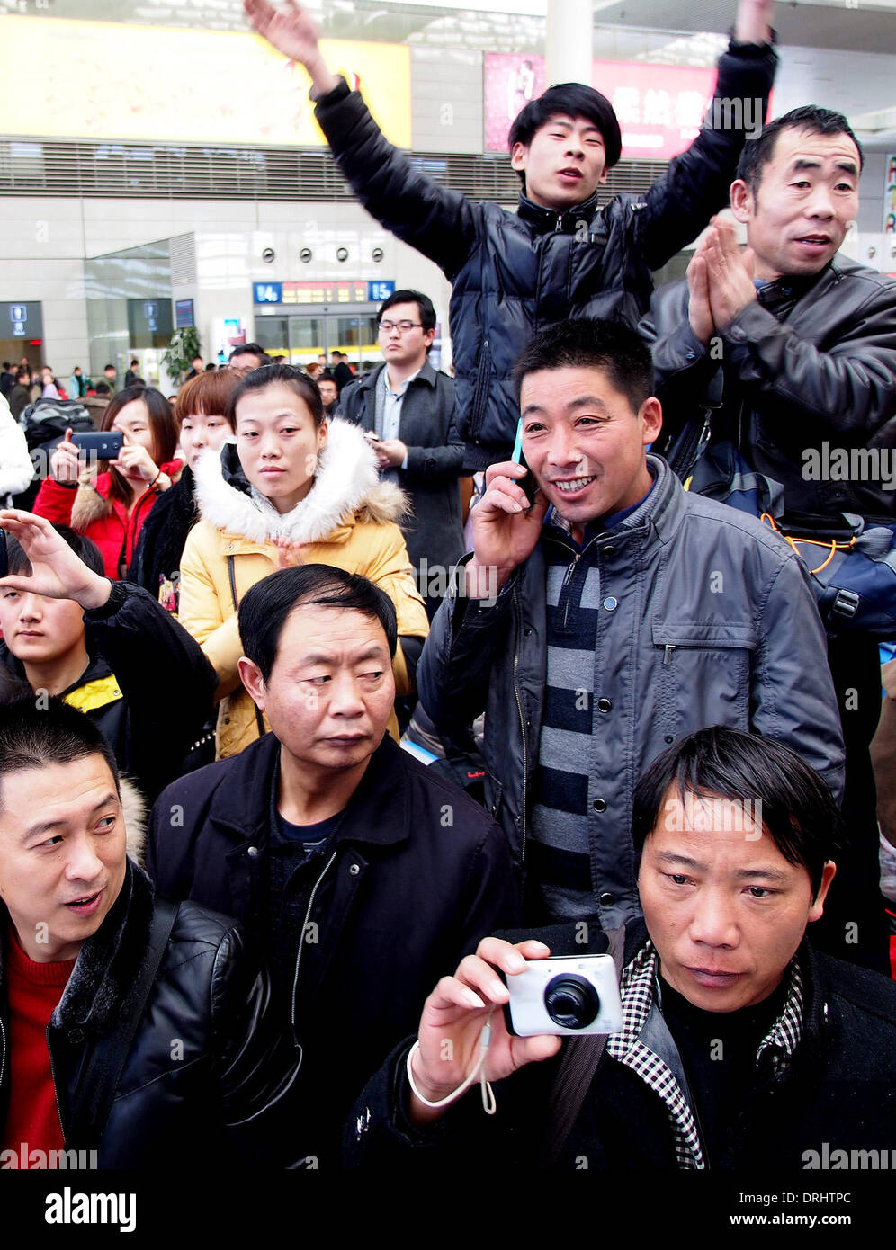 Shanghai, China. 27th Jan, 2014. Passengers cheer for the sudden ...