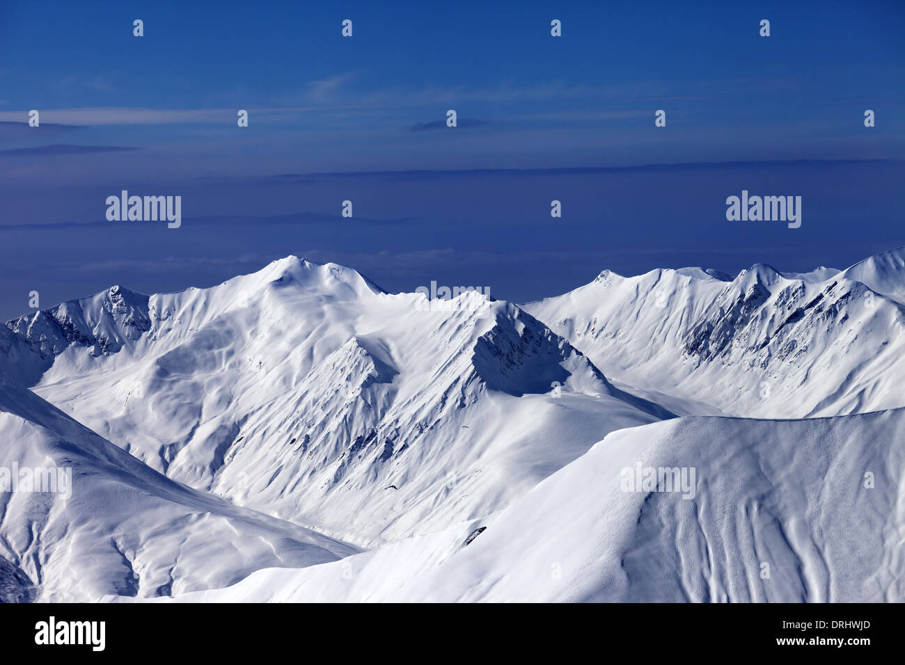 View on off-piste snowy slope at nice day. Caucasus Mountains, Georgia ...