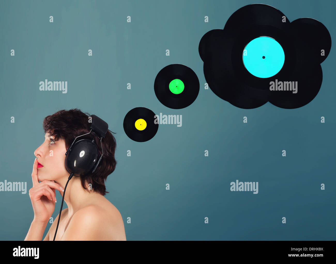 young woman thinking about music with vinyl record thinking balloons ...