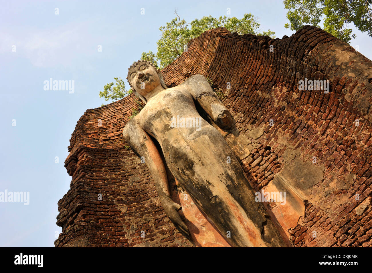 Ancient standing buddha figure at the Kamphaeng Phet Historical Park in ...