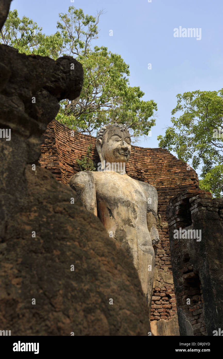 Ancient standing buddha figure at Kamphaeng Phet Historical Park in ...