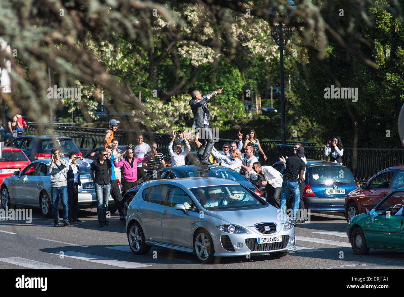 Man dancing on top of car during a bridal motorcade France Stock Photo ...