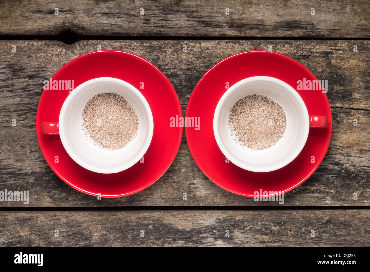 Pair of Red Cups with Powdered Coffee on old Wood Background. Top View ...