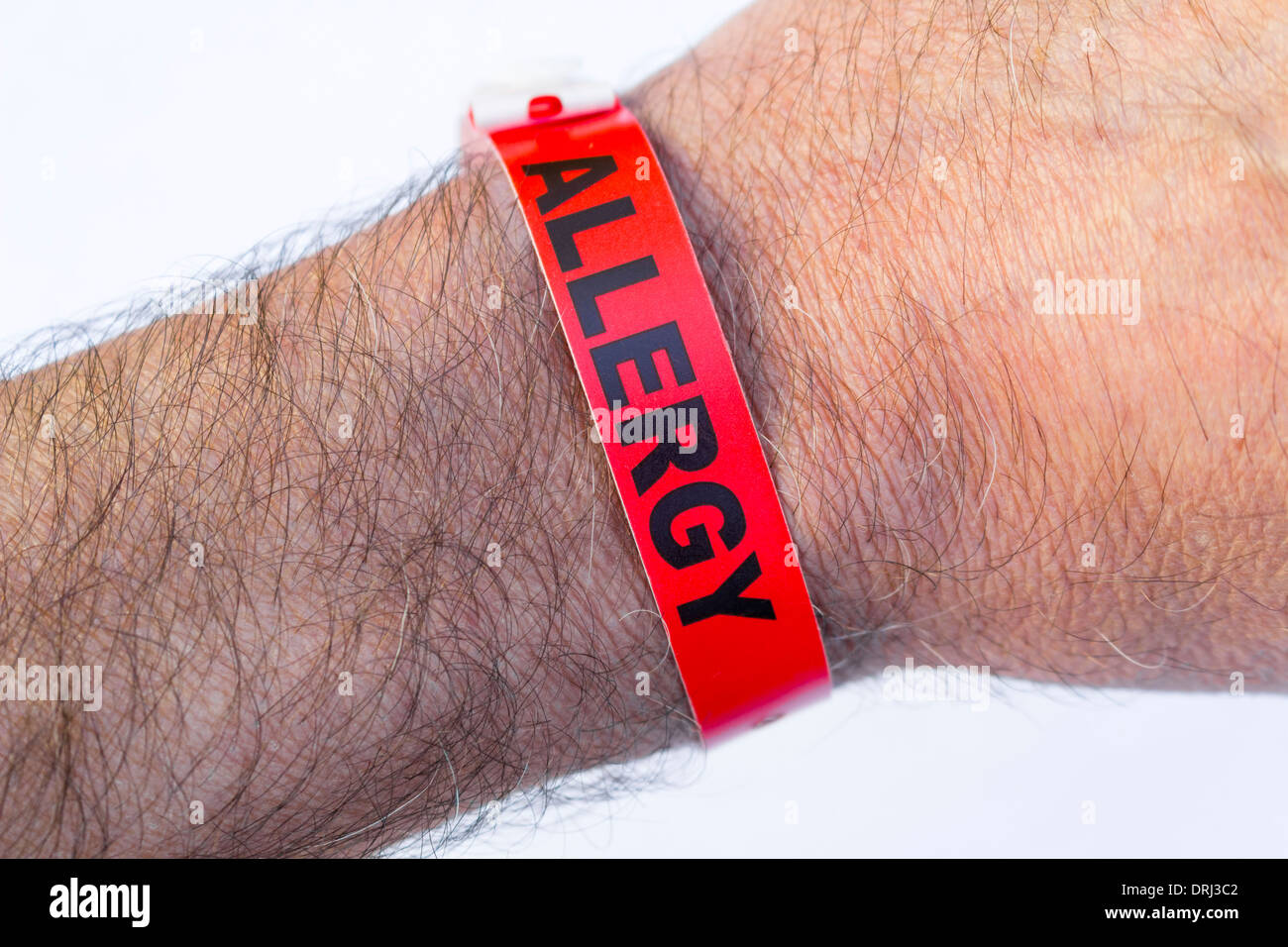 An allergy bracelet worn on a man's wrist Stock Photo - Alamy