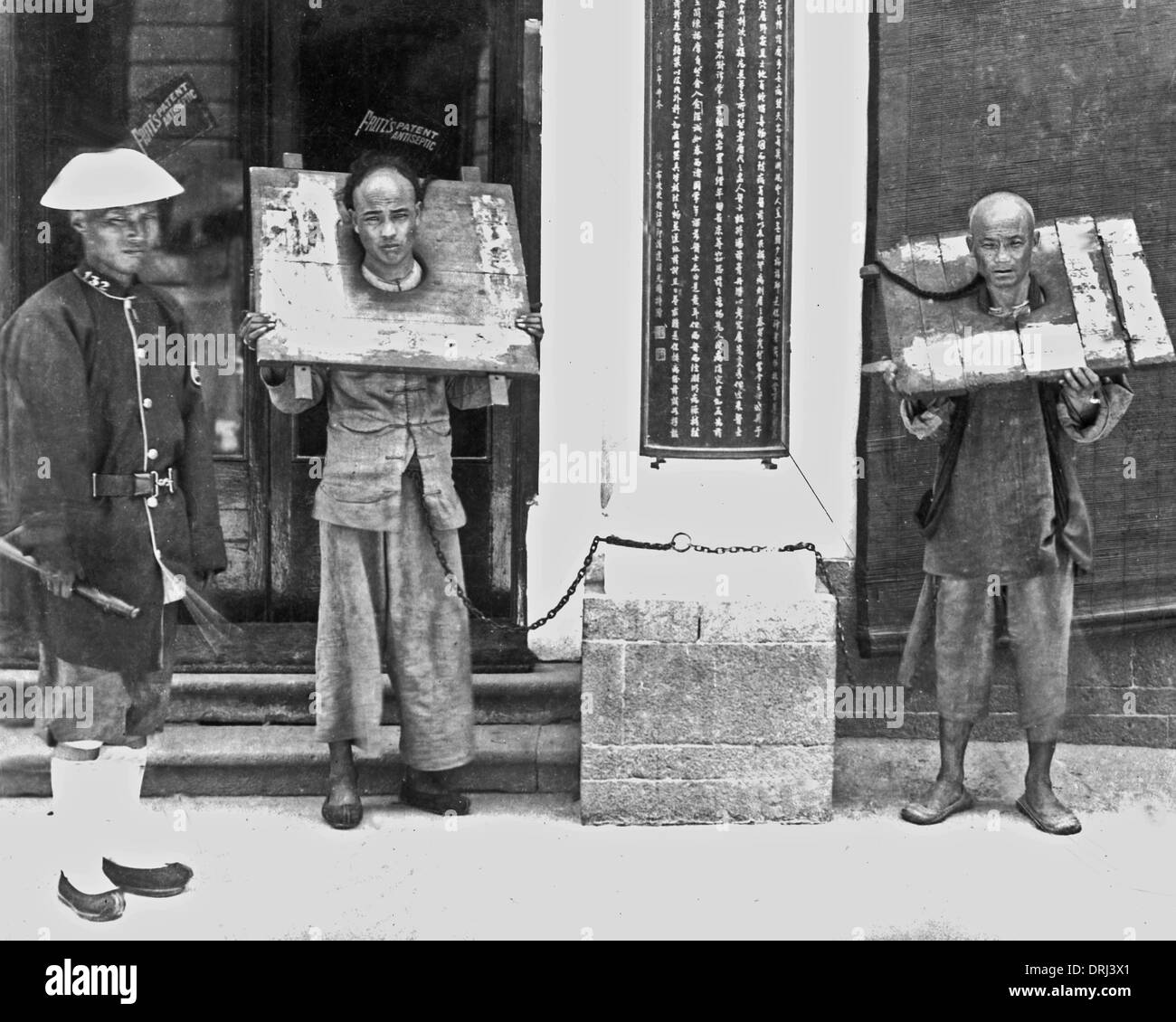 Prisoners wearing the Cangue, China Stock Photo - Alamy