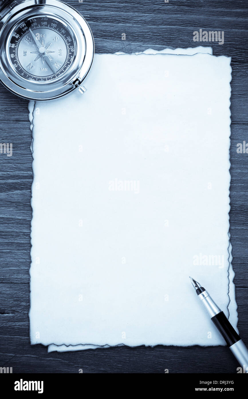 ink pen and compass on parchment background texture Stock Photo - Alamy