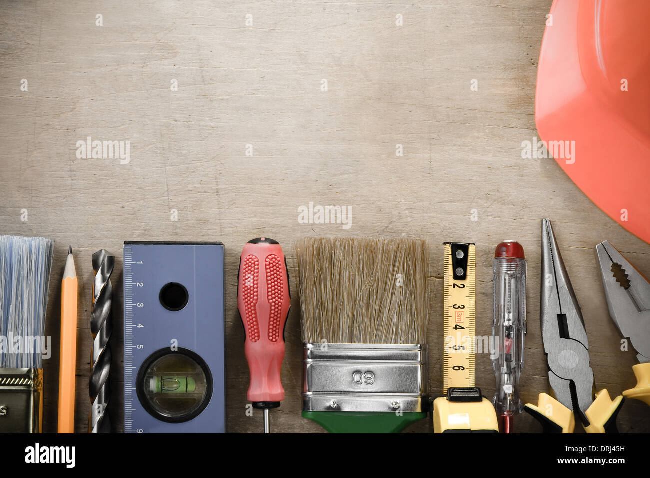 kit of construction tools and instruments on wood texture background ...
