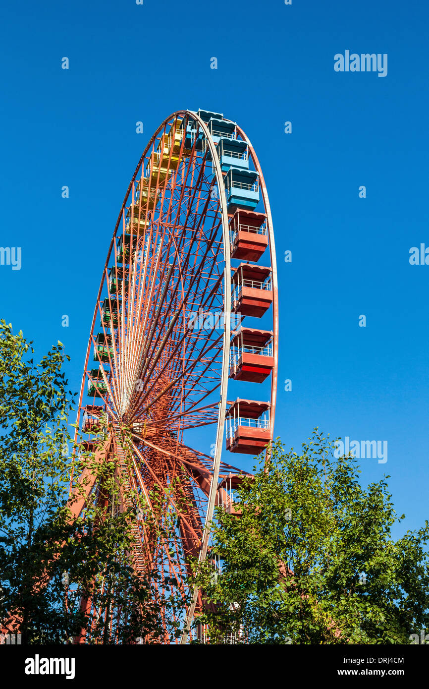 Disused, broken, decrepit ferris wheel at the abandoned amusement park ...