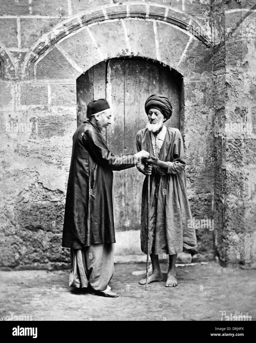 Giving alms Black and White Stock Photos & Images - Alamy