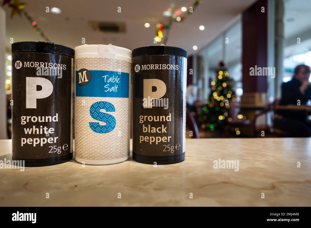 Salt and pepper on a table at a Morrison's cafe, Corby, England Stock ...