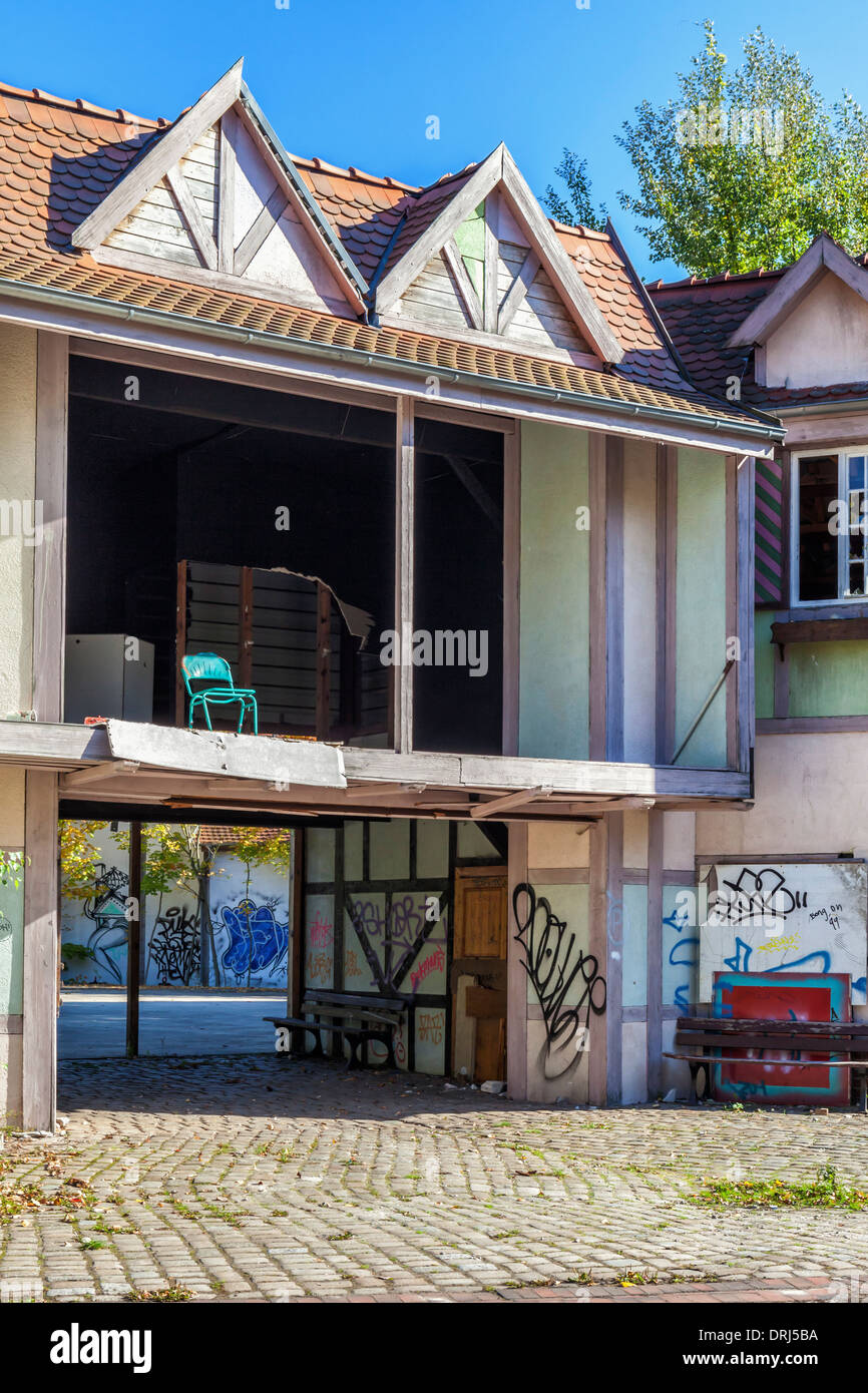 Anandoned theme park - decrepit English village with hole in wall and ...