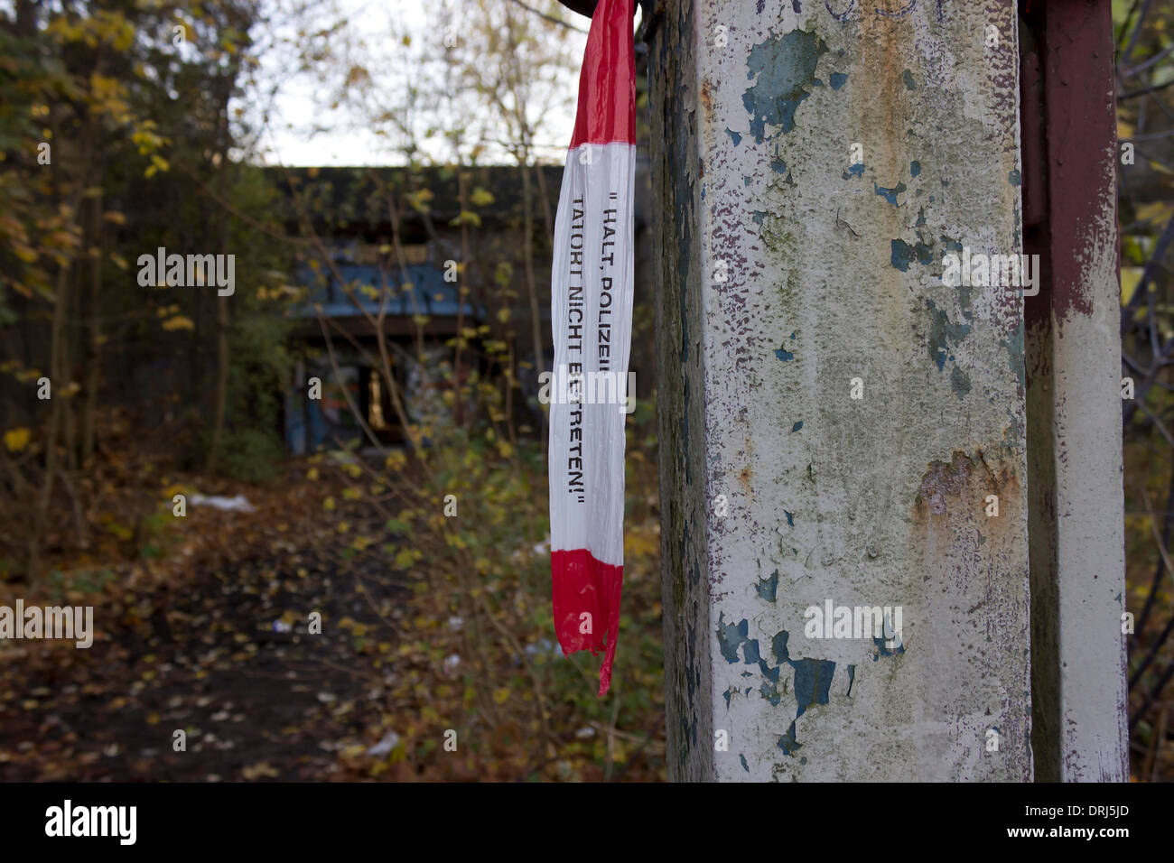 Crime Scene: Torn Police Line Do Not Enter Stock Photo - Alamy