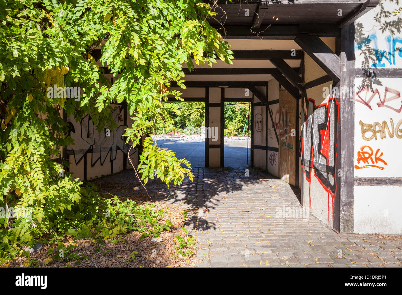 Graffiti covered courtyard of English village at the abandoned ...