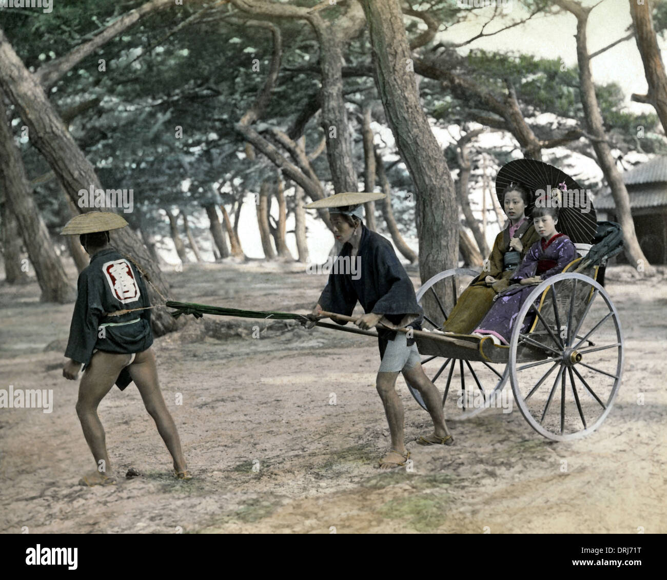 Two girls in a rickshaw, Japan Stock Photo - Alamy