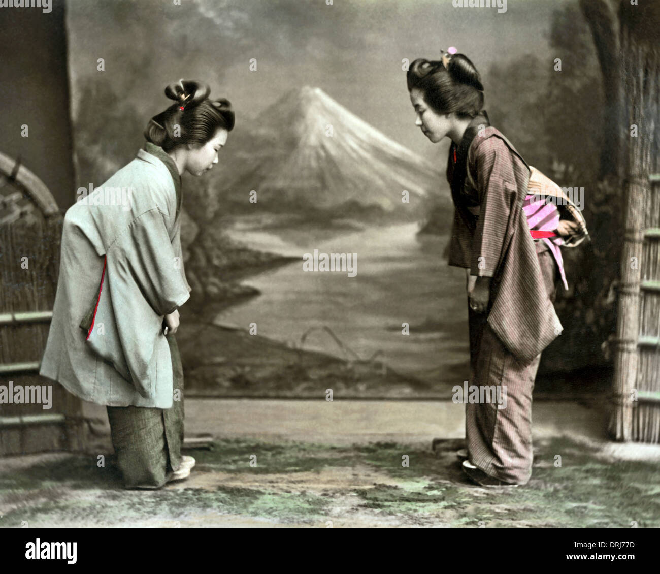 Two women in formal greeting, Japan Stock Photo - Alamy