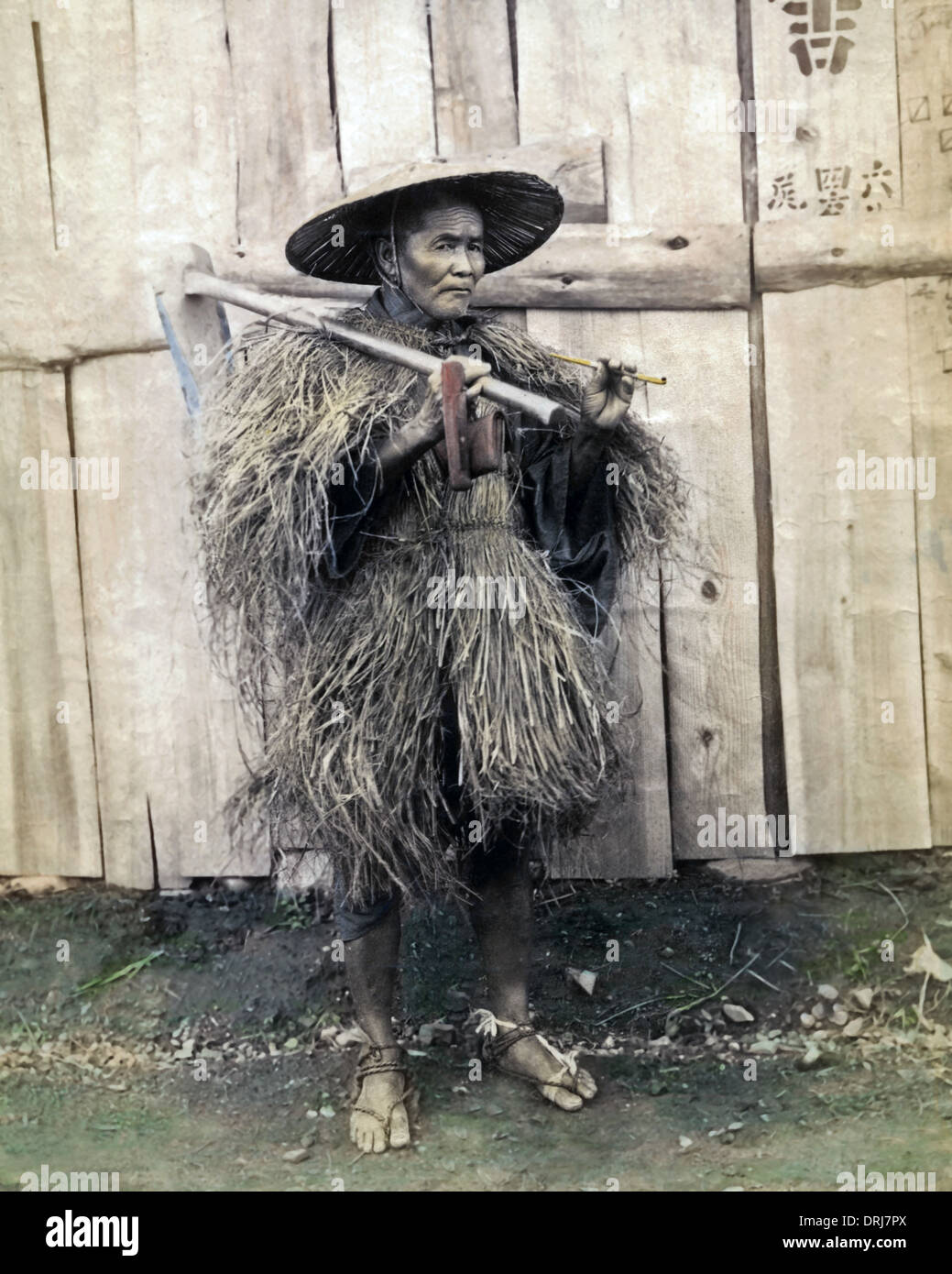 Farmer in grass coat, Japan Stock Photo - Alamy