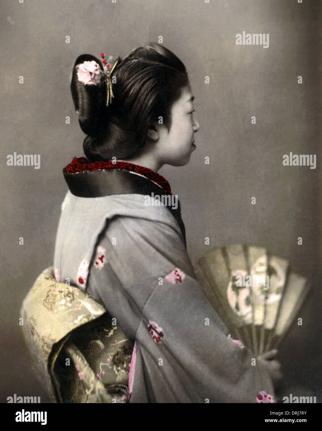 Geisha with obi sash and fan, Japan Stock Photo - Alamy