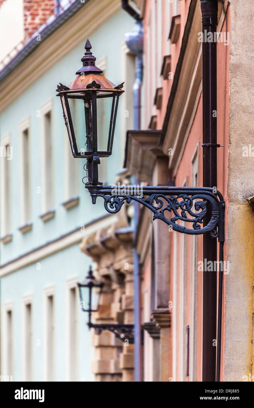 An ornate street light against the background of a historic house ...