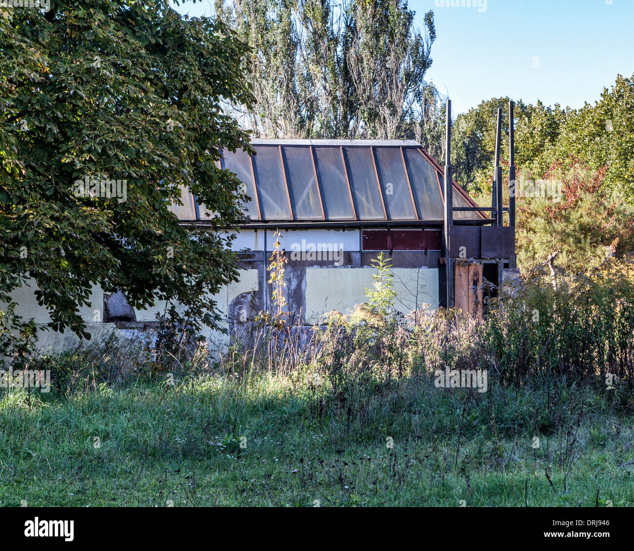 Abandoned, decrepit weed-covered buildings of the Spreepark amusement ...