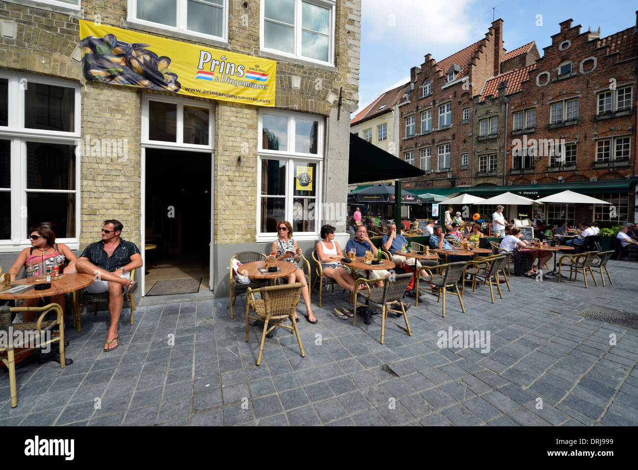 Visitors enjoy good weather in street cafe, street restaurant, guild ...