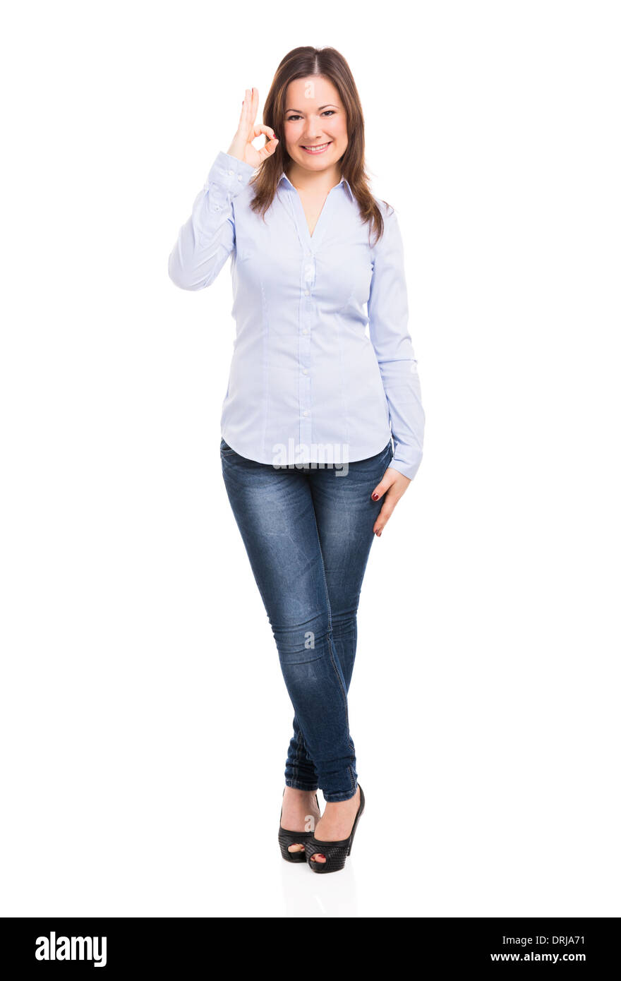 Beautiful woman smiling and doing a ok signal with her hand, isolated ...