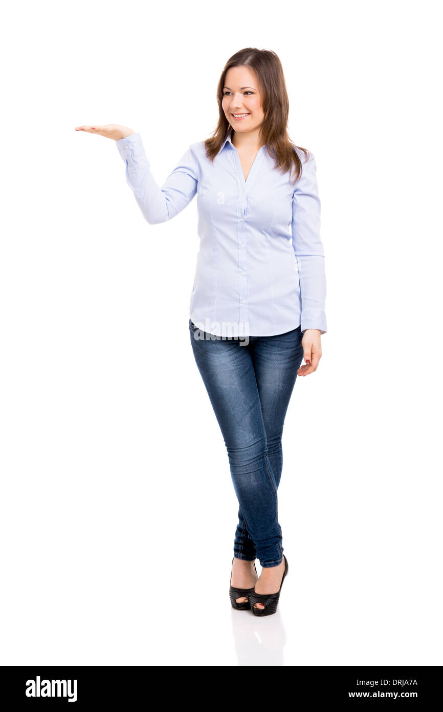 Beautiful woman smiling and showing the palm of her right hand ...