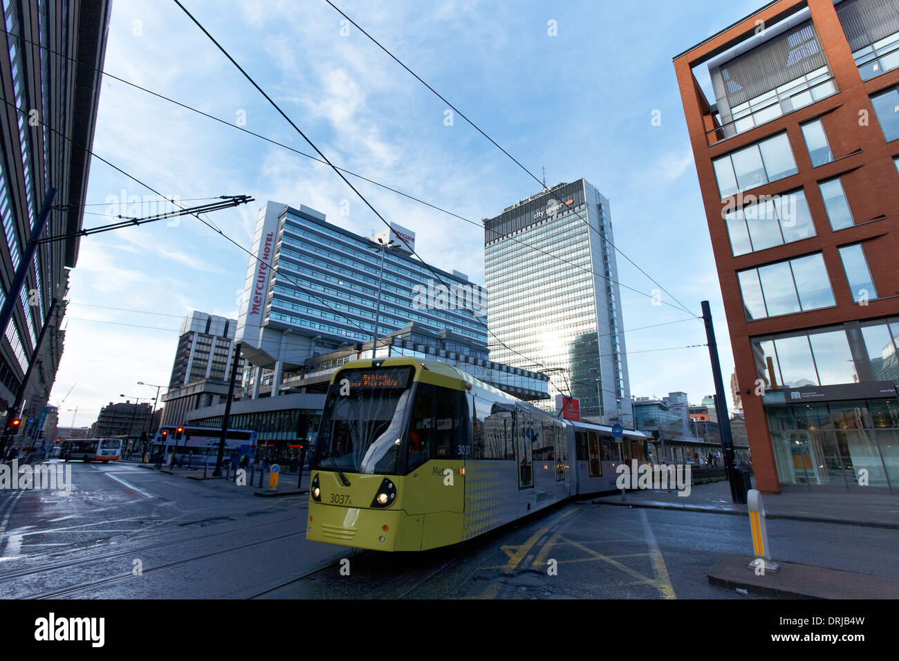 Tram leaving Piccadilly bus station in the city centre of Manchester UK ...