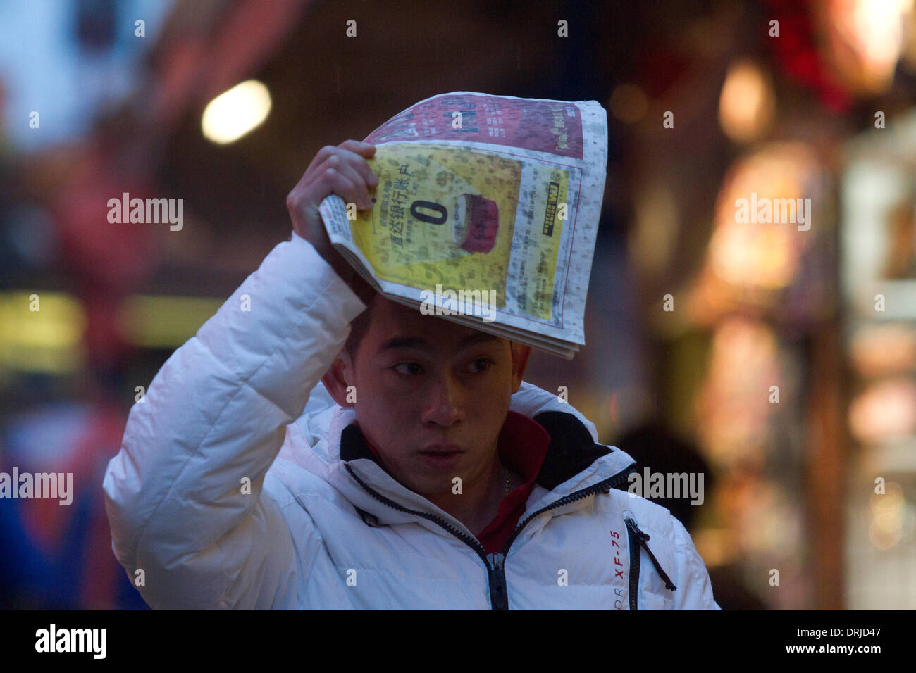 Man raining newspaper hi-res stock photography and images - Alamy