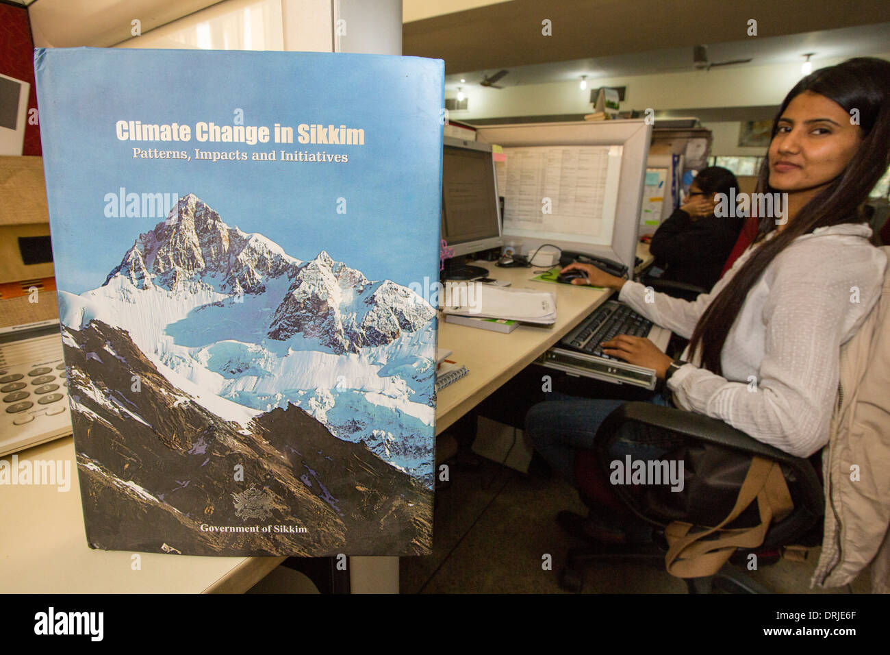A Climate change in Sikkim report book on the desk of a WWF India ...