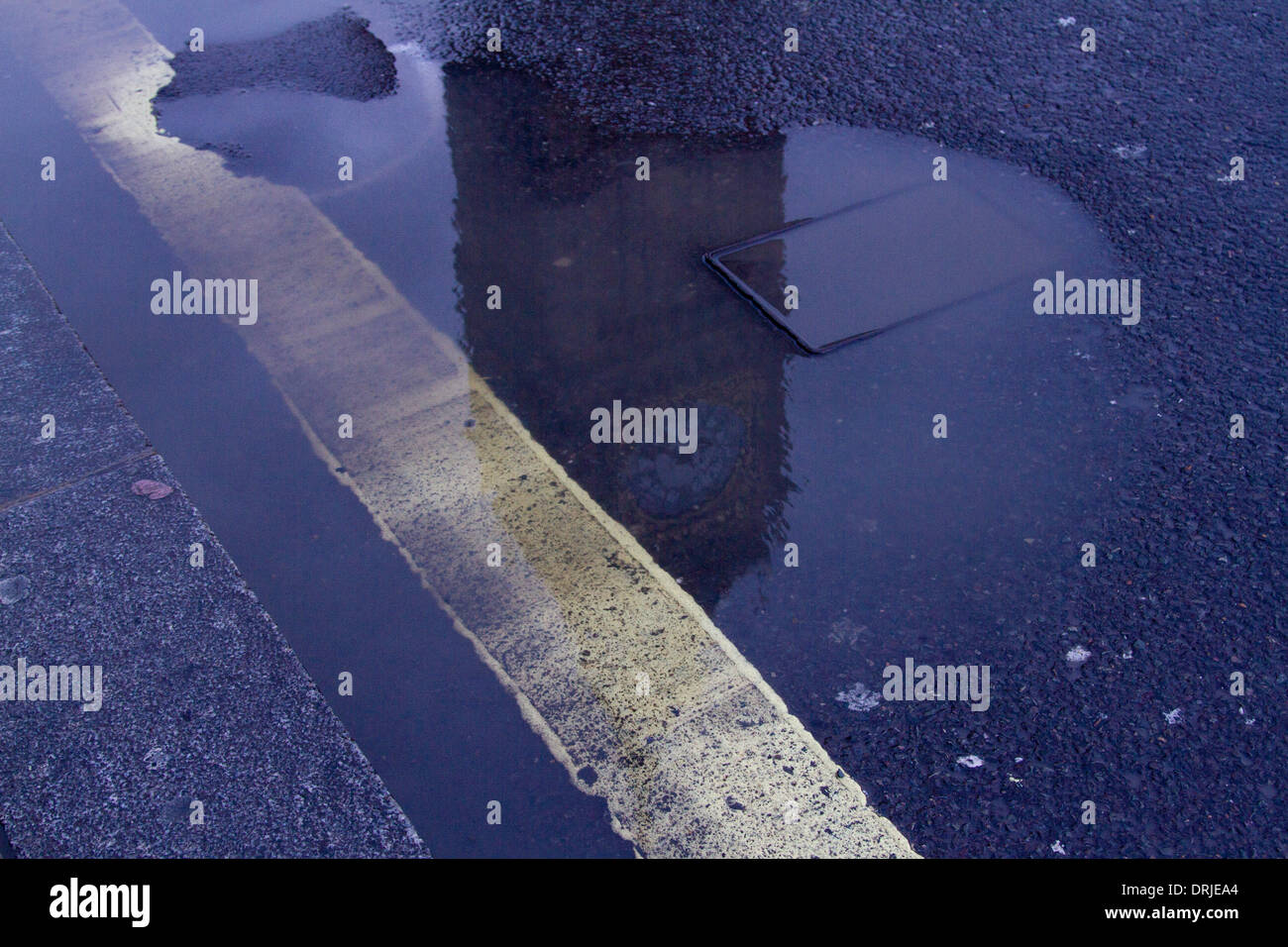 Westminster London,UK. 27th January 2014. Big Ben reflected in a pool ...
