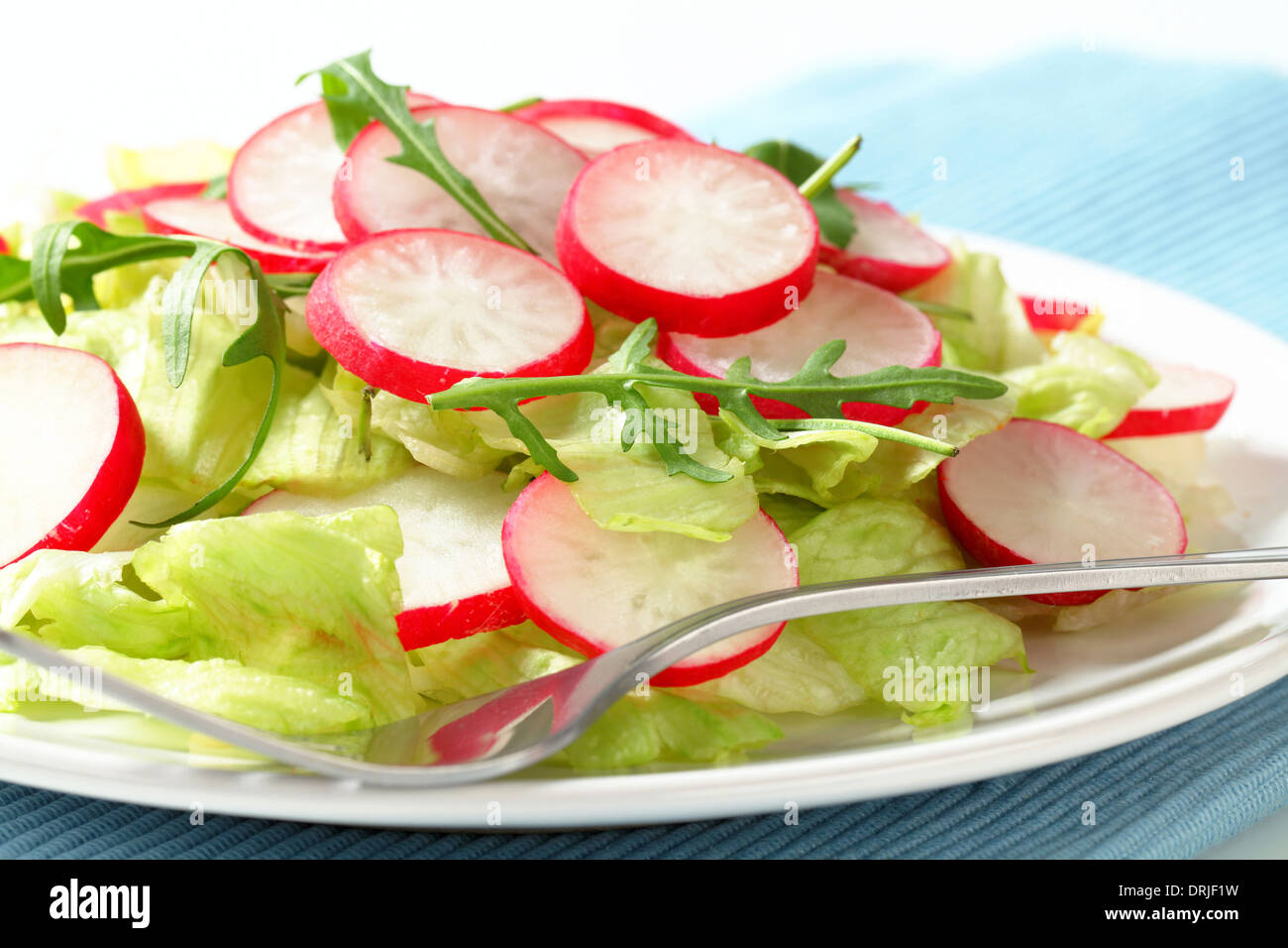 Green salad with sliced radish Stock Photo - Alamy