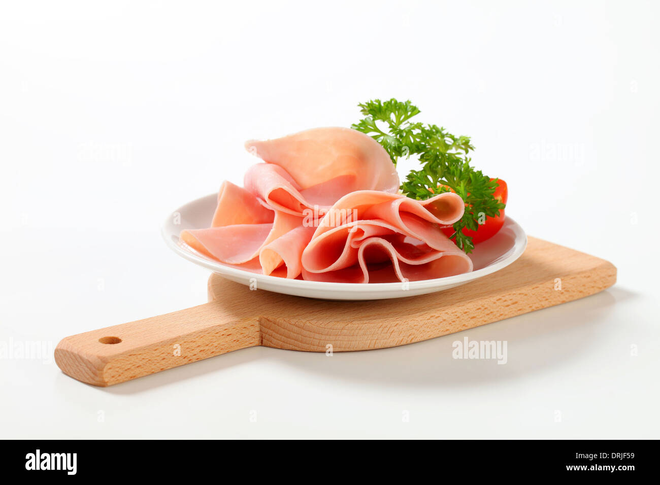 Thinly sliced ham - studio shot Stock Photo - Alamy