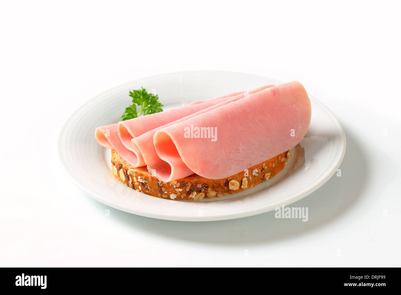 Slice of bread with ham Stock Photo - Alamy
