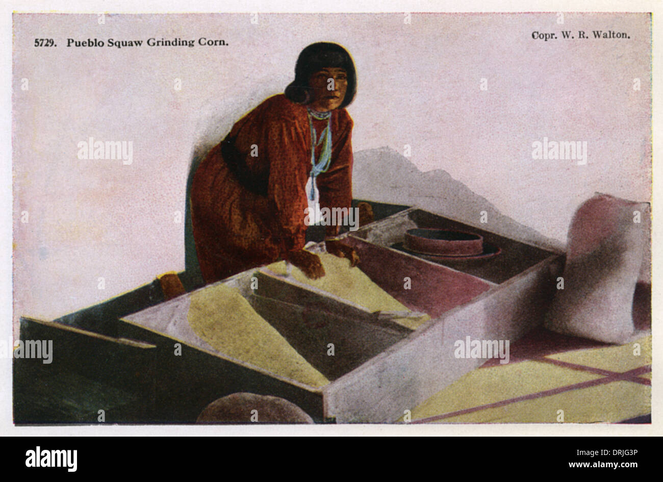 Pueblo Indian woman grinding corn Stock Photo - Alamy