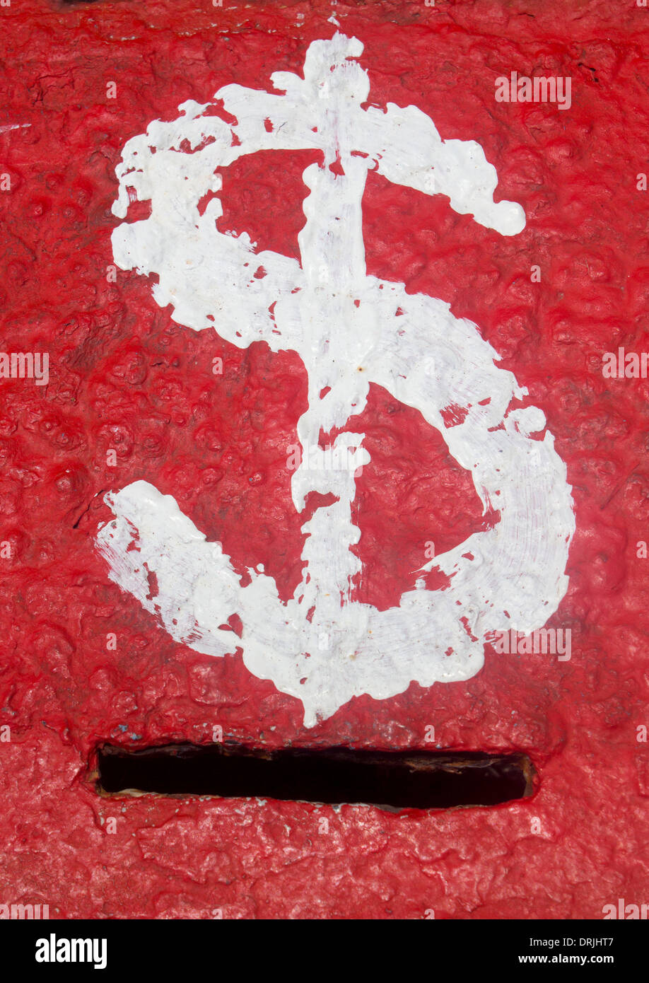 Painted dollar sign white on red background with money slit on top of ...