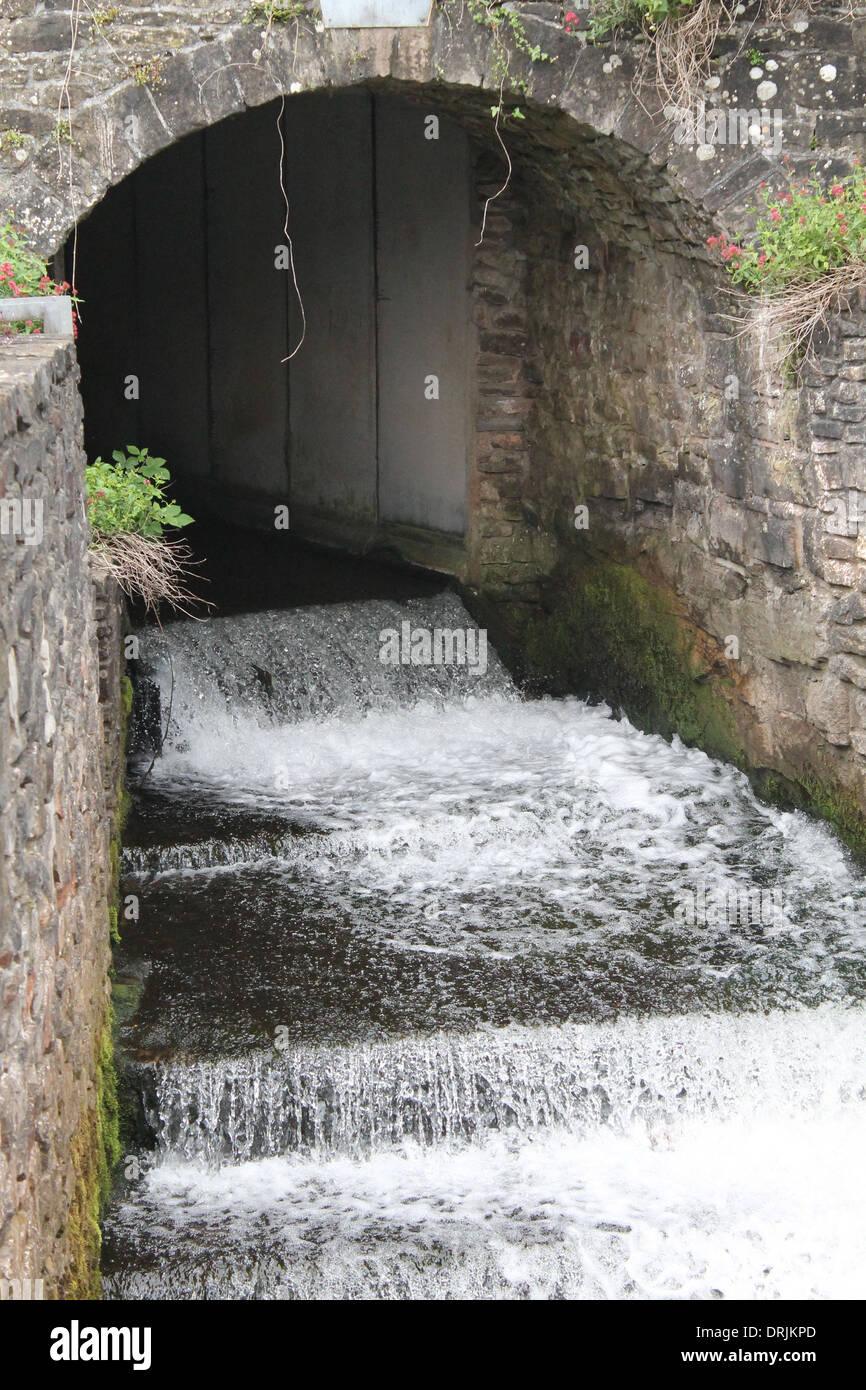 stepped waterfall under arched bridge taken at Tintern, Wales Stock ...