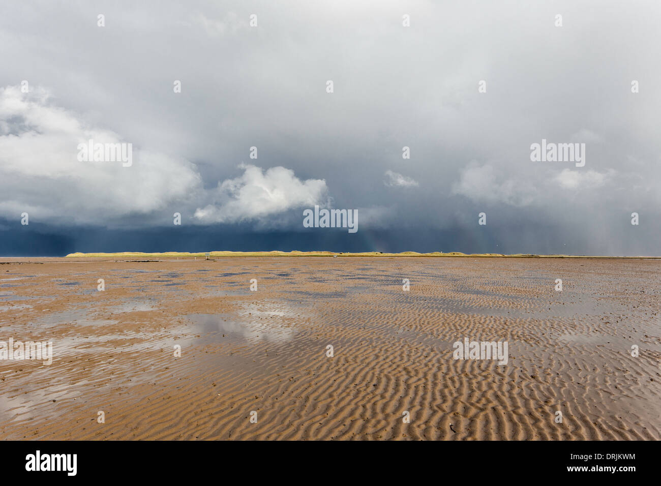 Storm clouds over Holy Island from Lindisfarne causeway, Northumberland ...